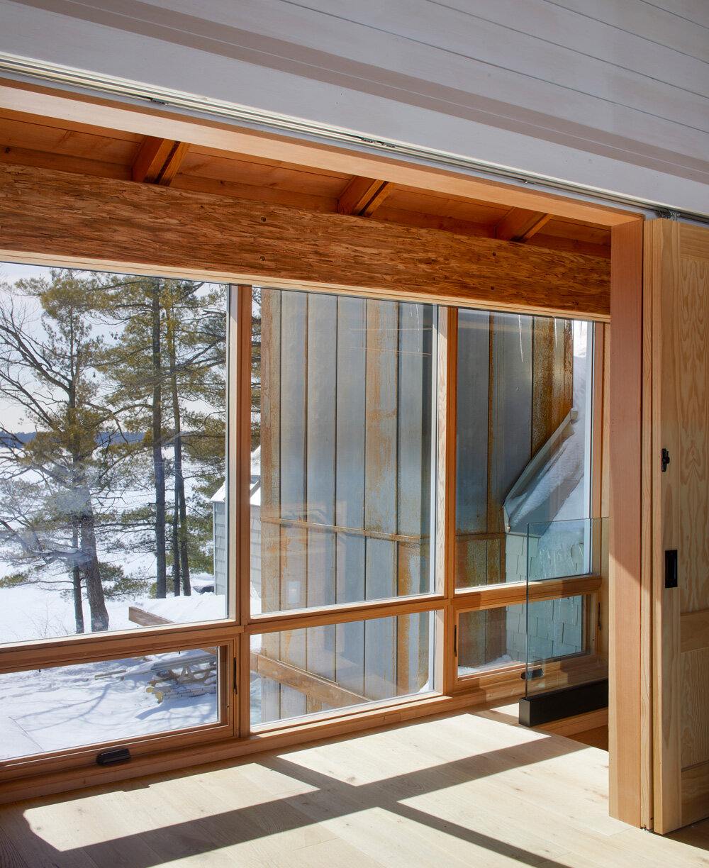 undulating shoreline envelops six mile lake cottage by BLDG workshop