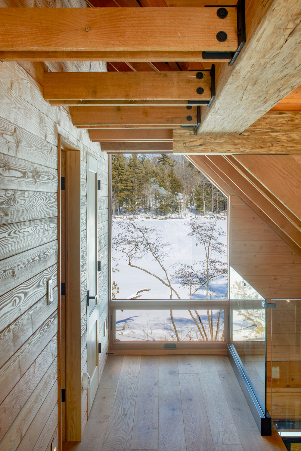 undulating shoreline envelops six mile lake cottage by BLDG workshop