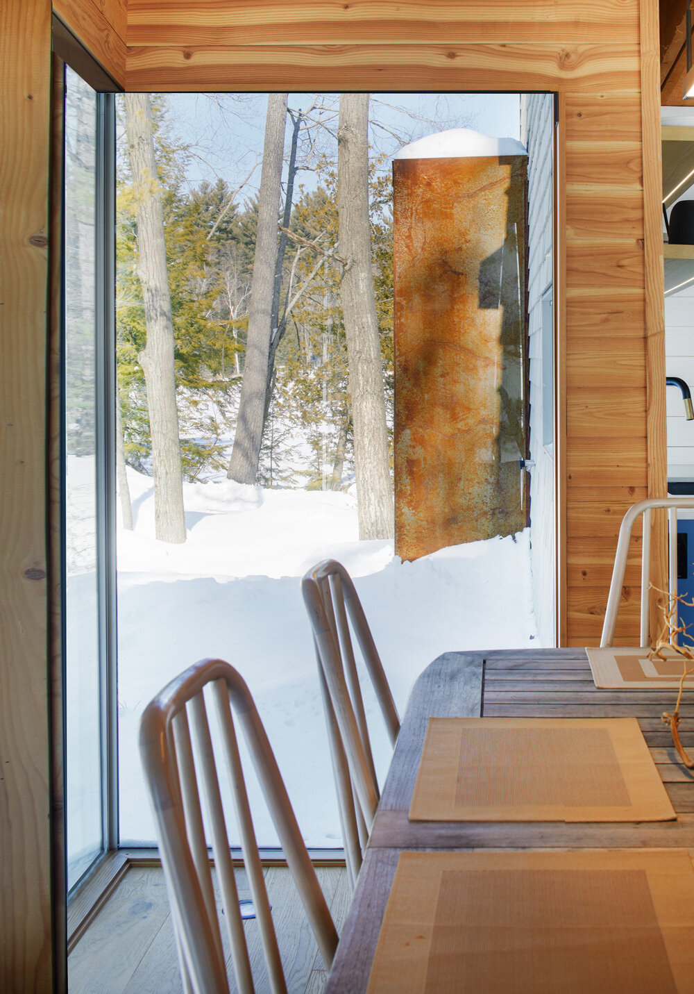 undulating shoreline envelops six mile lake cottage by BLDG workshop