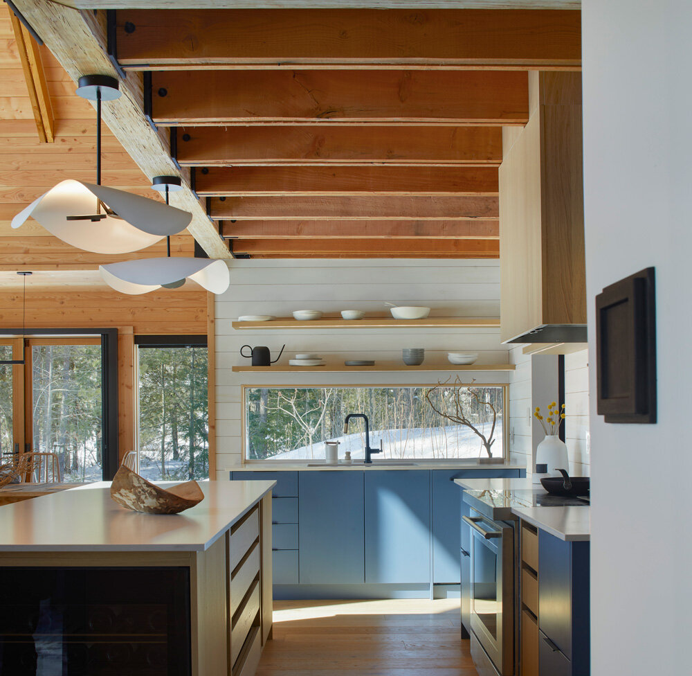 undulating shoreline envelops six mile lake cottage by BLDG workshop