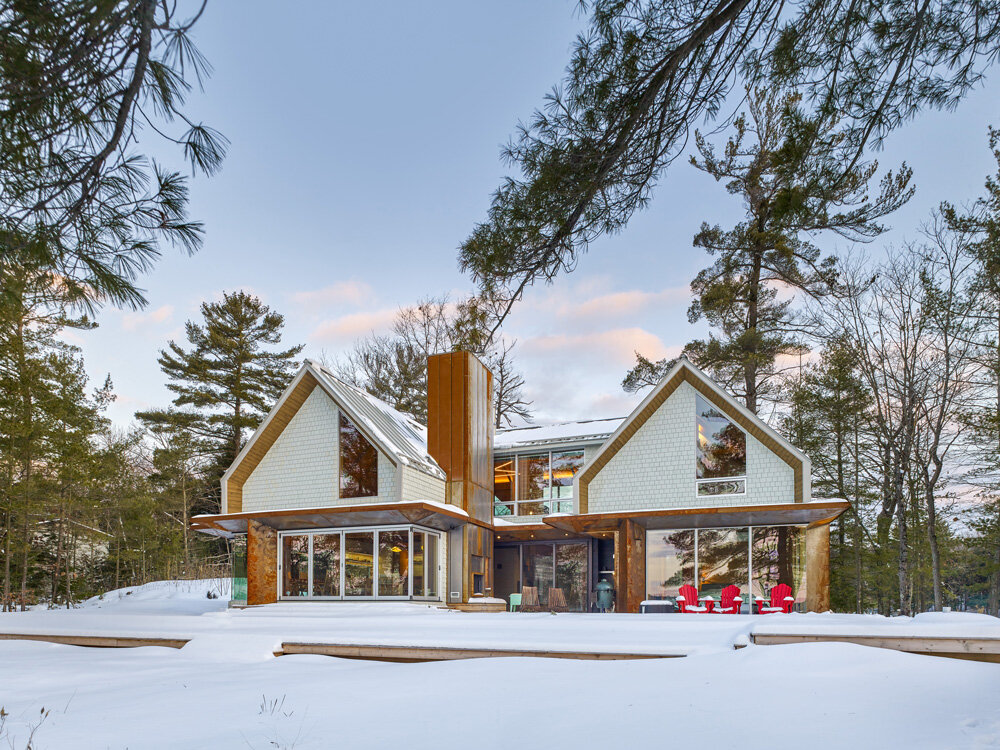 undulating shoreline envelops six mile lake cottage by BLDG workshop