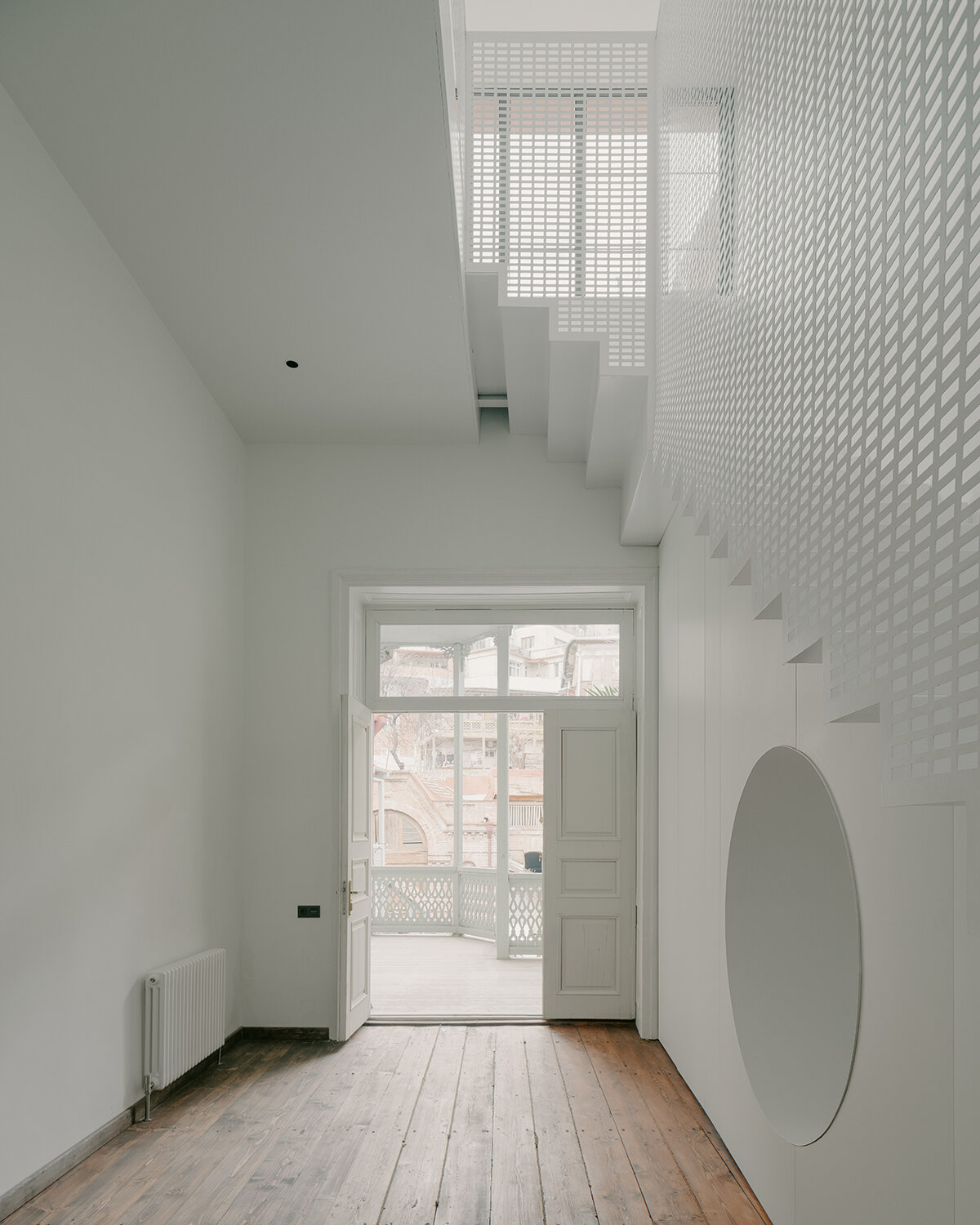 TIMM architecture converts tbilisi attic into bright 'birdsnest house'