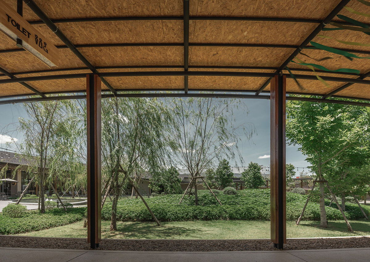 mobius studio designs 'egg yolk' shaped building in thailand