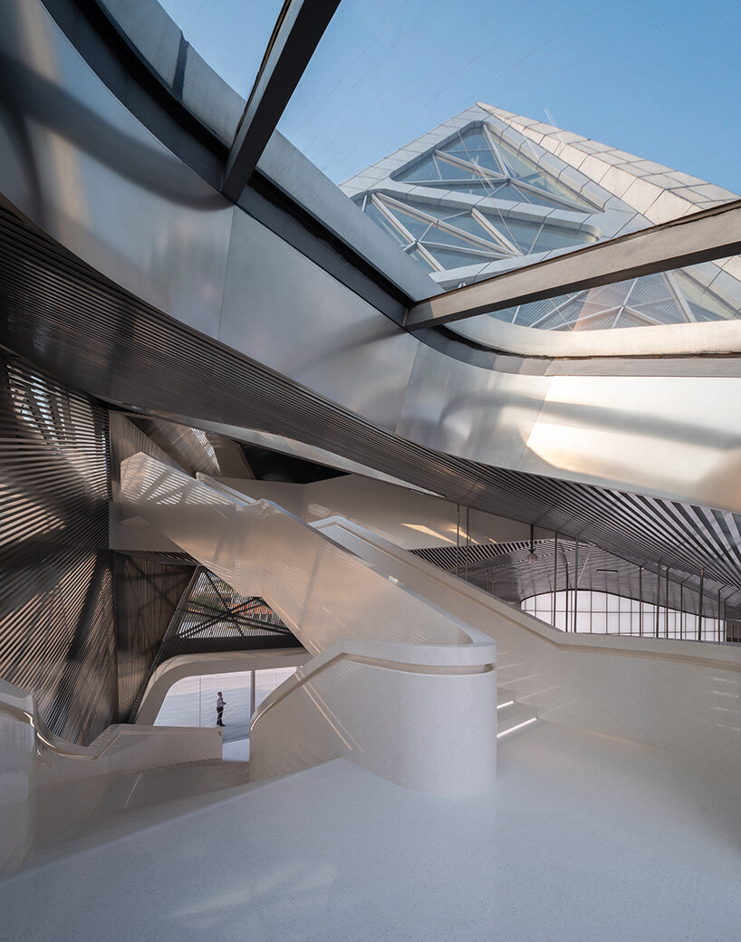 faceted glass curtain walls flood DJI's shenzhen origami-like flagship ...