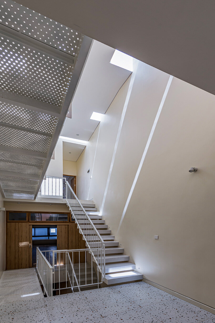 cutouts in slanted concrete roof illuminate vietnamese residence by DMA ...