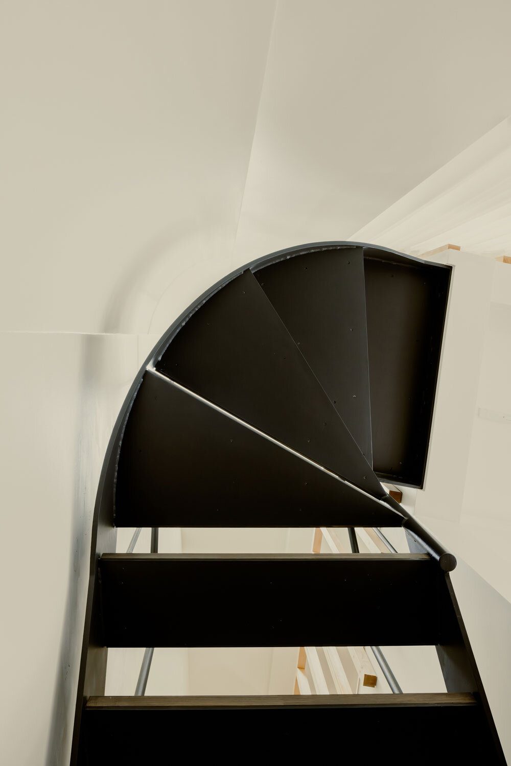 rotated wall shapes triangular voids within wooden house in tokyo