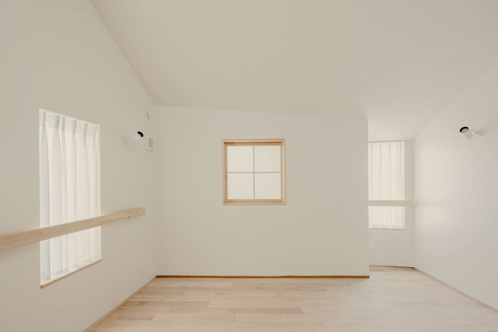 rotated wall shapes triangular voids within wooden house in tokyo