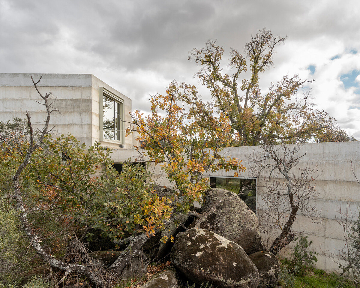 durable castilian fortresses inspire this 'house X' by bojaus arquitectura