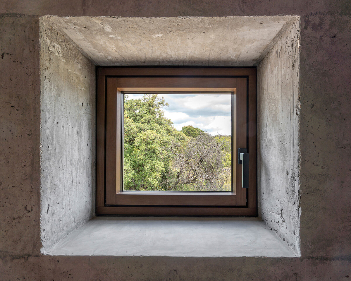 durable castilian fortresses inspire this 'house X' by bojaus arquitectura