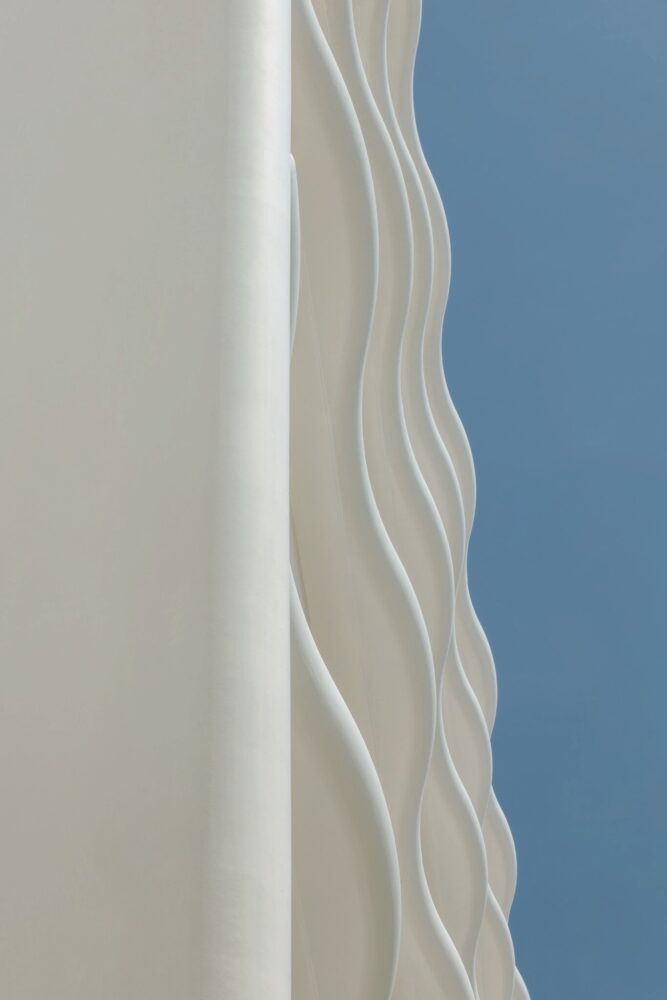 vertical wave-like white forms by onion envelop pattaya hotel